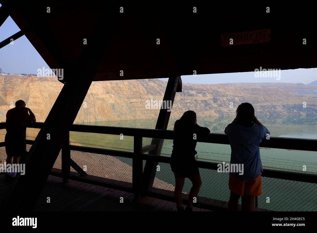 Visitors at viewing platform looking at Berkeley Pit, an open pit ...