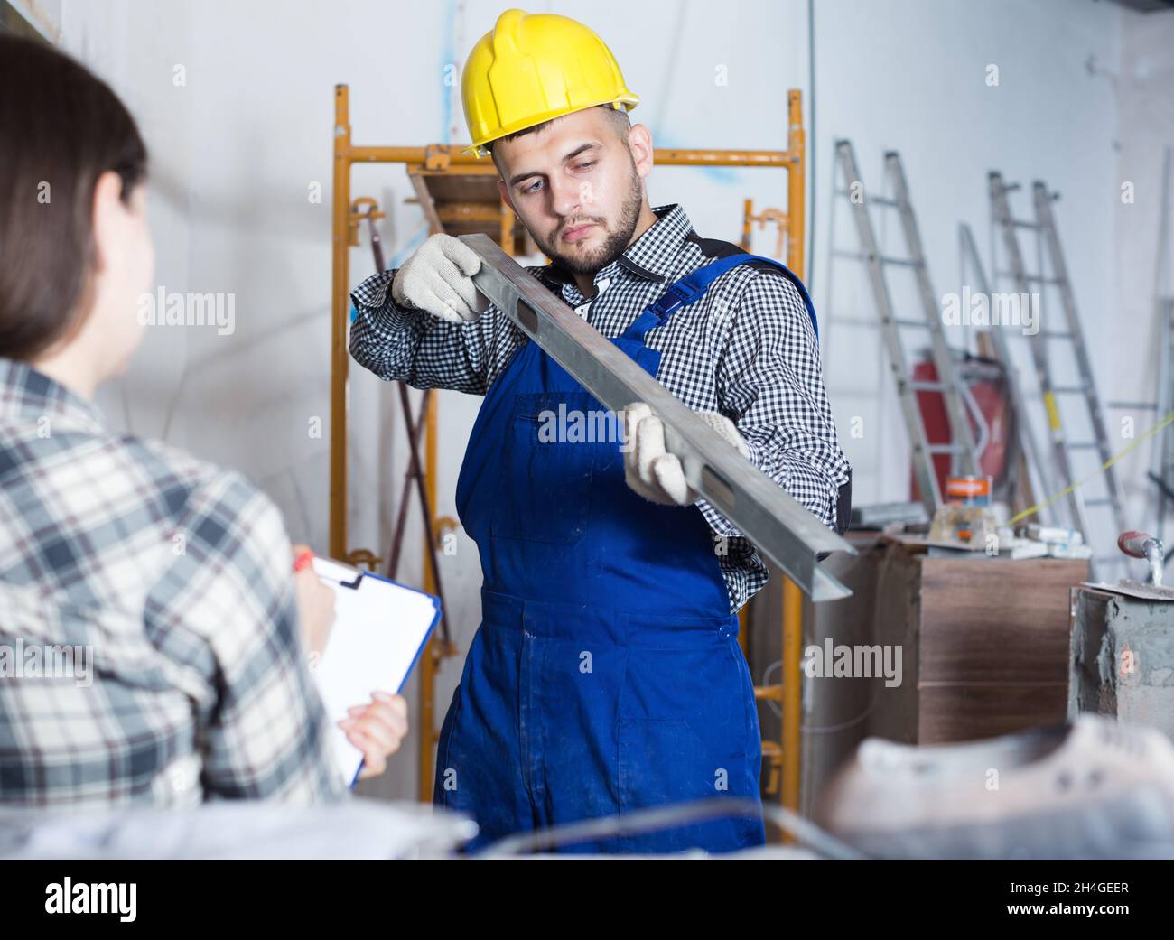 Client woman is showing the level of the profile to client Stock Photo ...