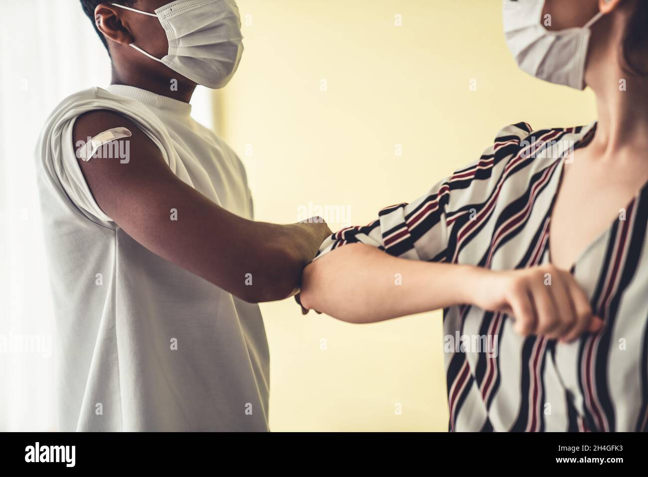 Student bumping elbows hi-res stock photography and images - Alamy