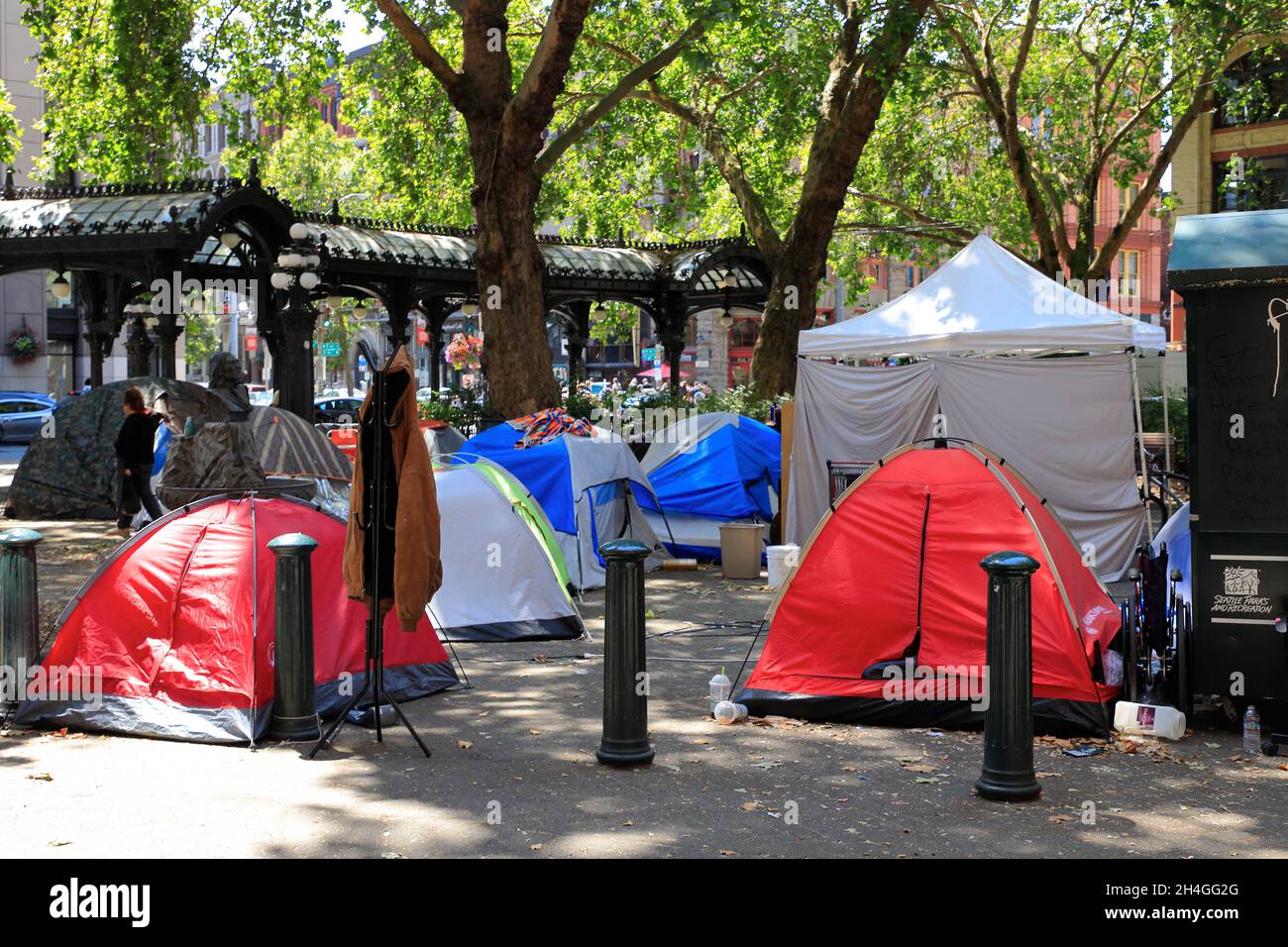Homeless people's encampment and tents in Pioneer Square with historic ...