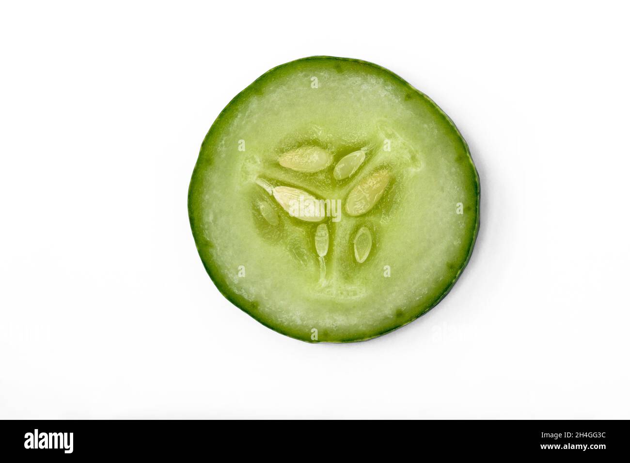 One slice of cucumber for fresh vegetables, isolated on white ...