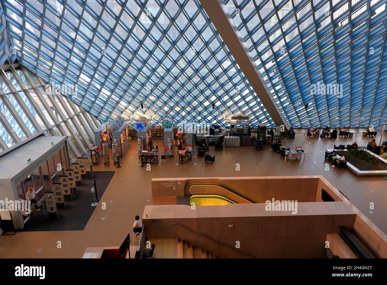 Interior view of Seattle Central Library with sloped glass roof ...