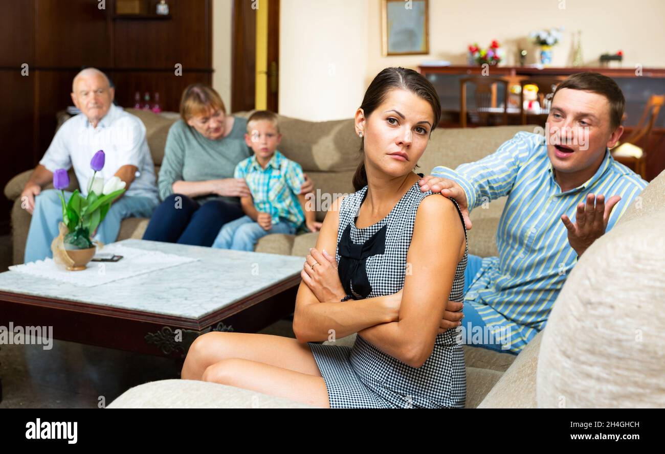 Scowling woman after quarrel with husband and parents Stock Photo - Alamy