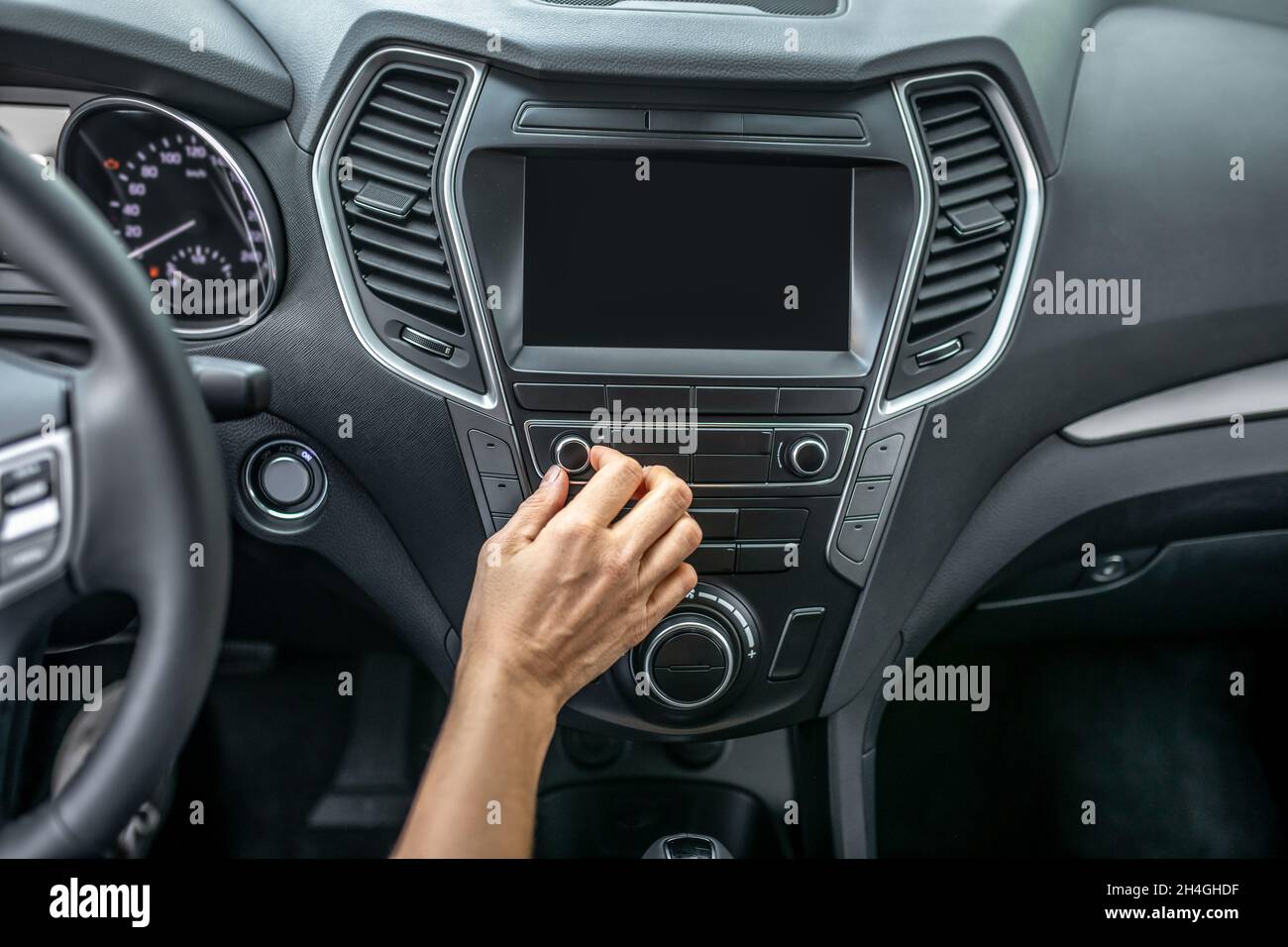 Womans hand touching dashboard in car Stock Photo - Alamy