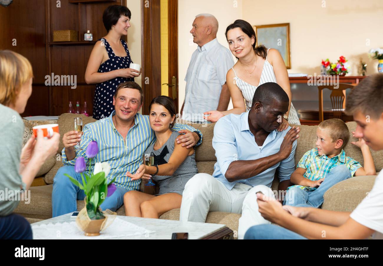 Friendly family meeting Stock Photo - Alamy