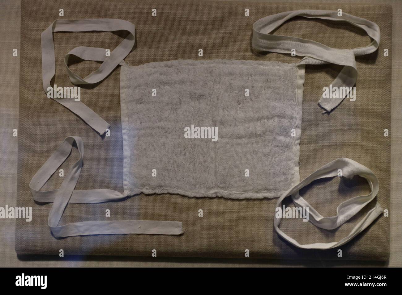 A gauze face mask for fighting the 1918 flu epidemic in Seattle display ...