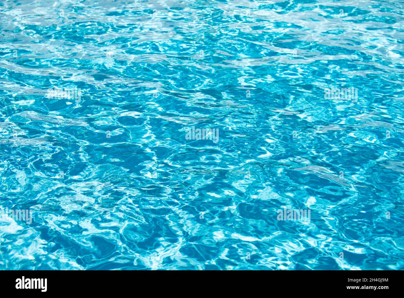 Abstract ripple wave and clear turquoise water surface in swimming pool ...
