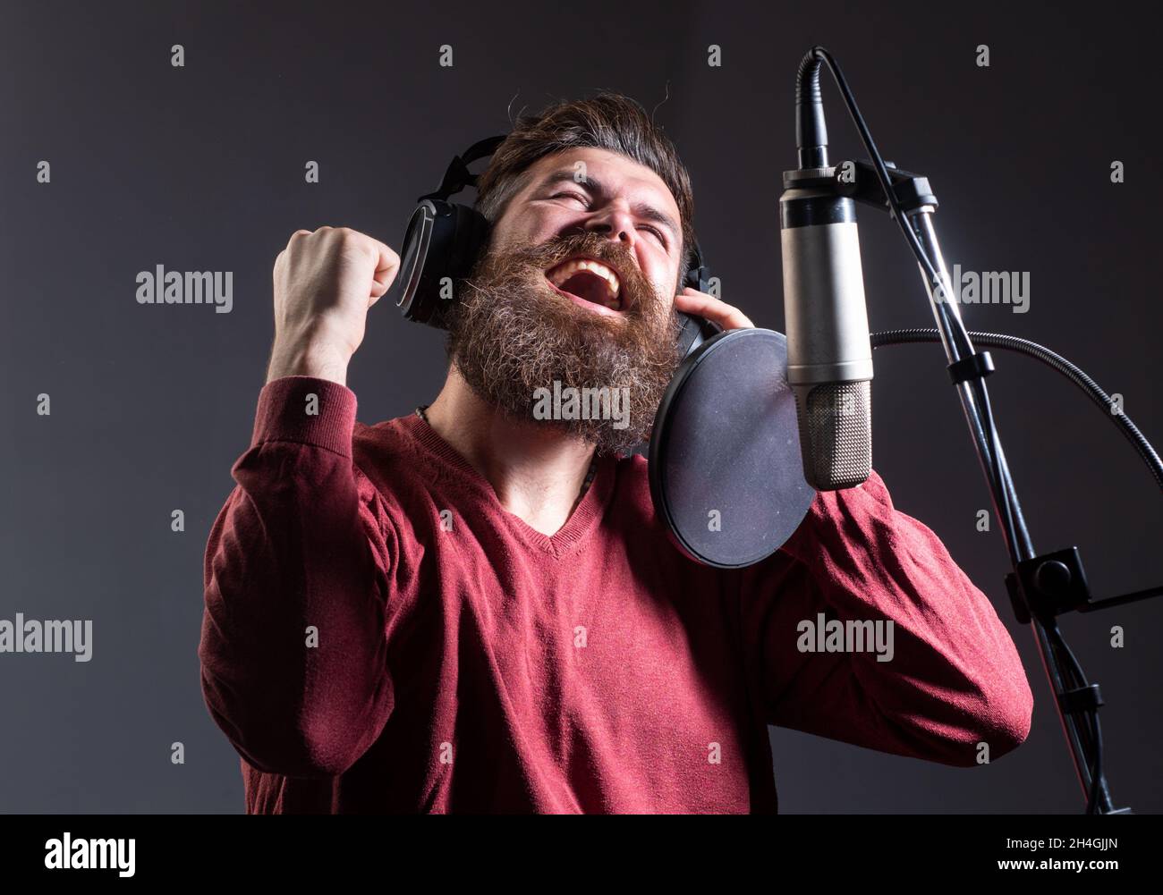 Singer singing rock. Expression face close up. Sound producer recording ...