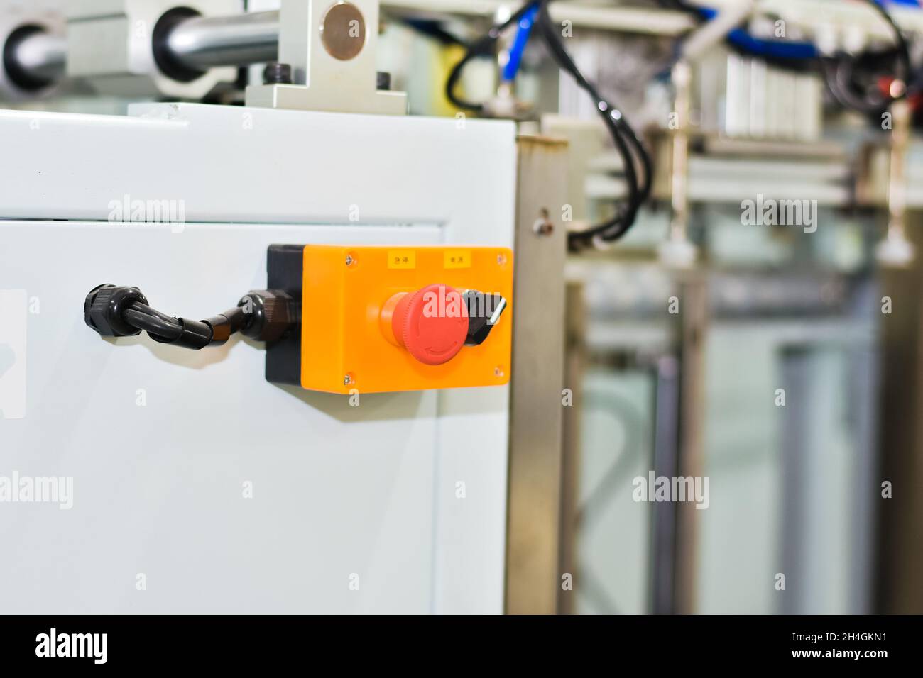 Emergency button for controlling the operation of the machine in the ...