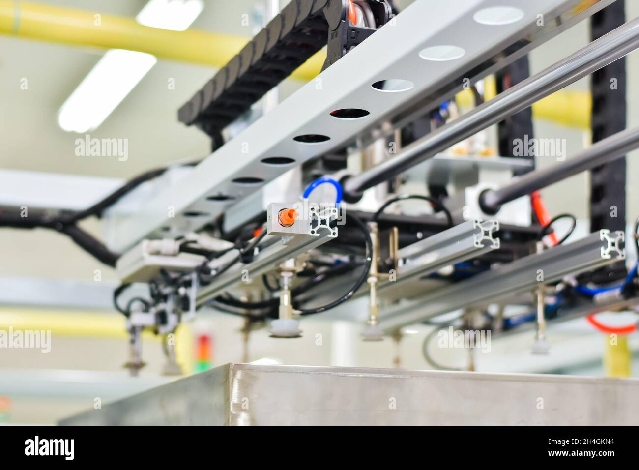 vacuum suction rubber stopper on conveyer machine in factory Stock ...