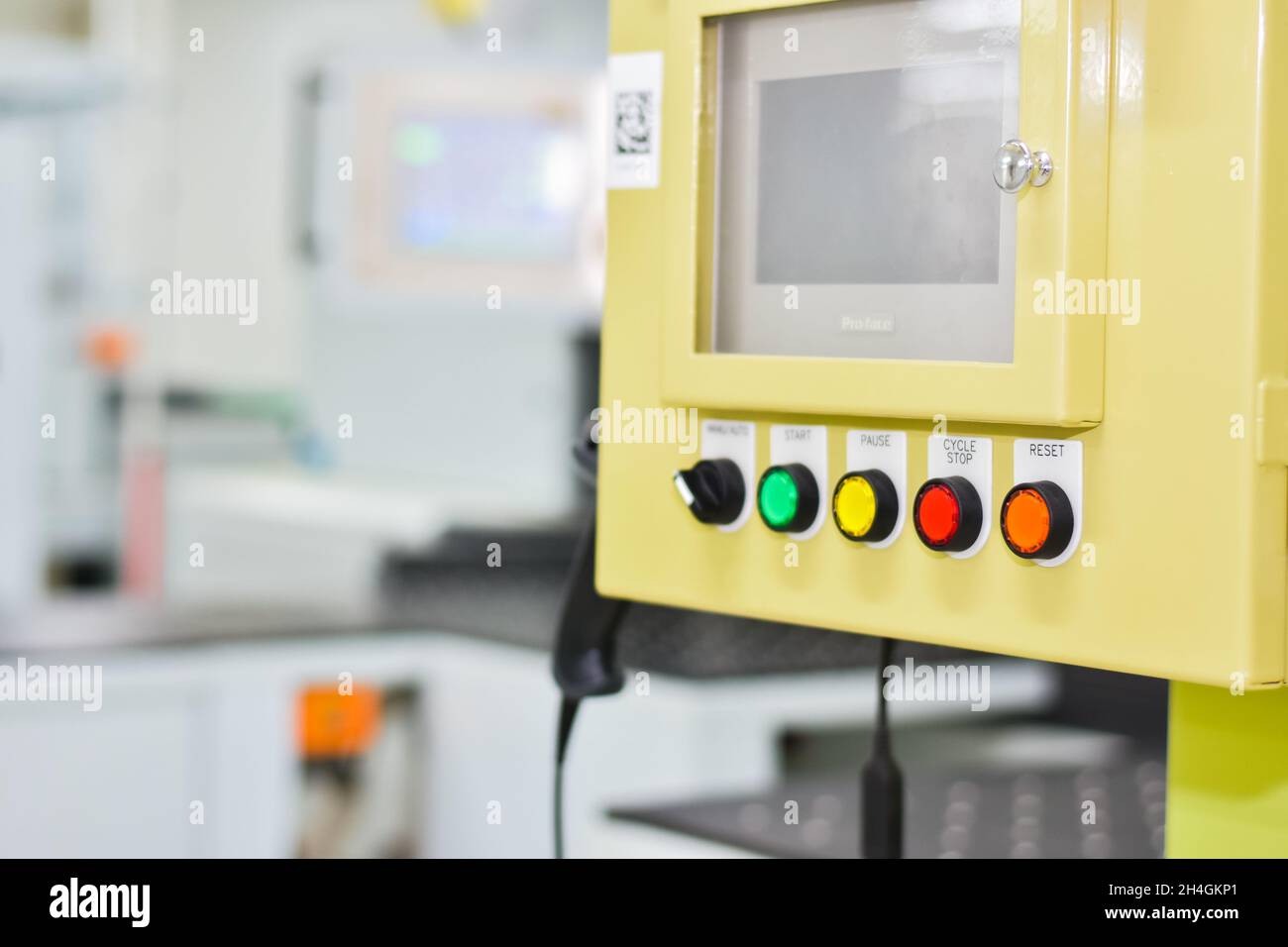 Buttons to control the operation of machines in the manufacturing ...