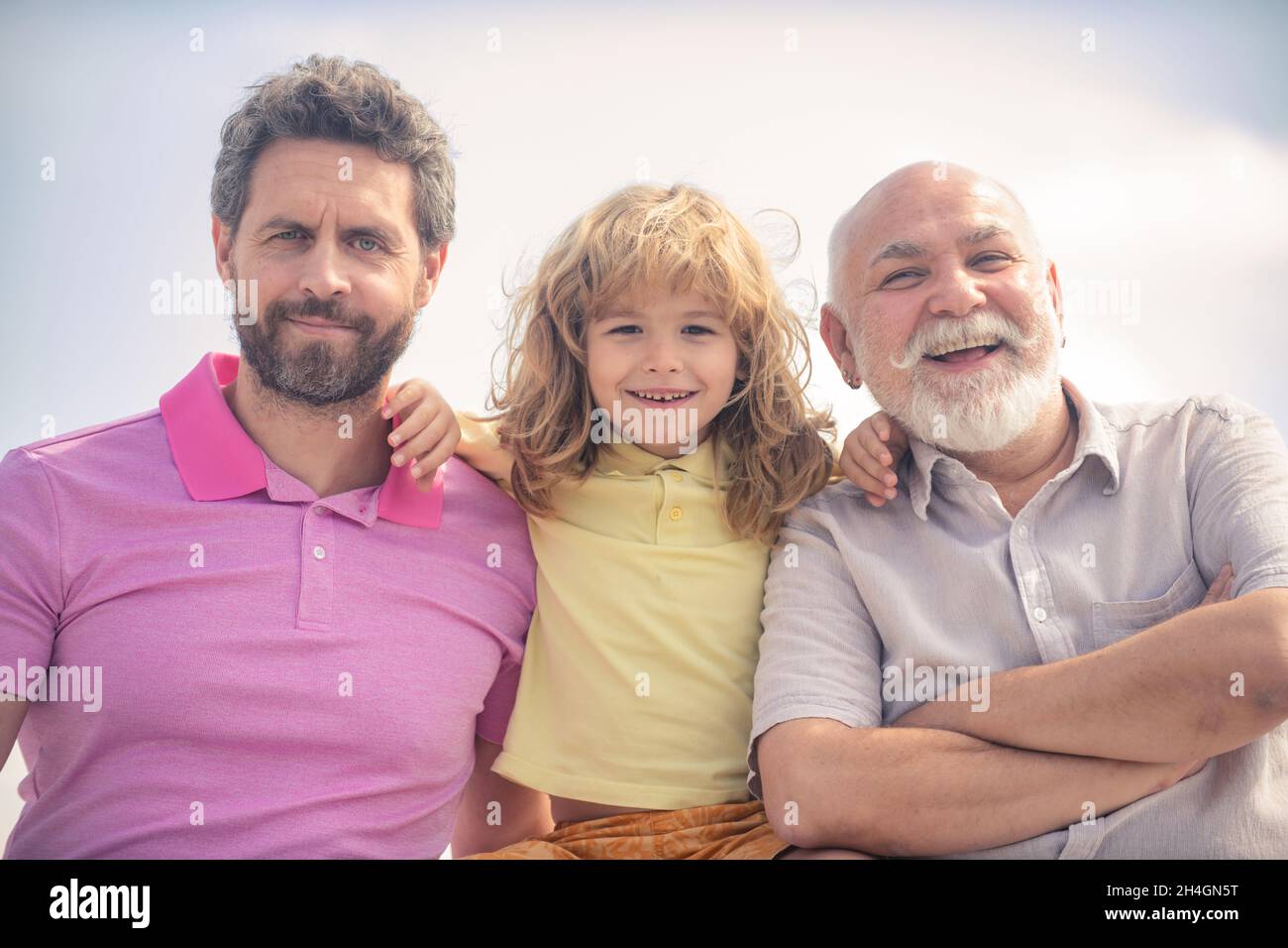 Men generation portrait of happy grandfather father and son child ...