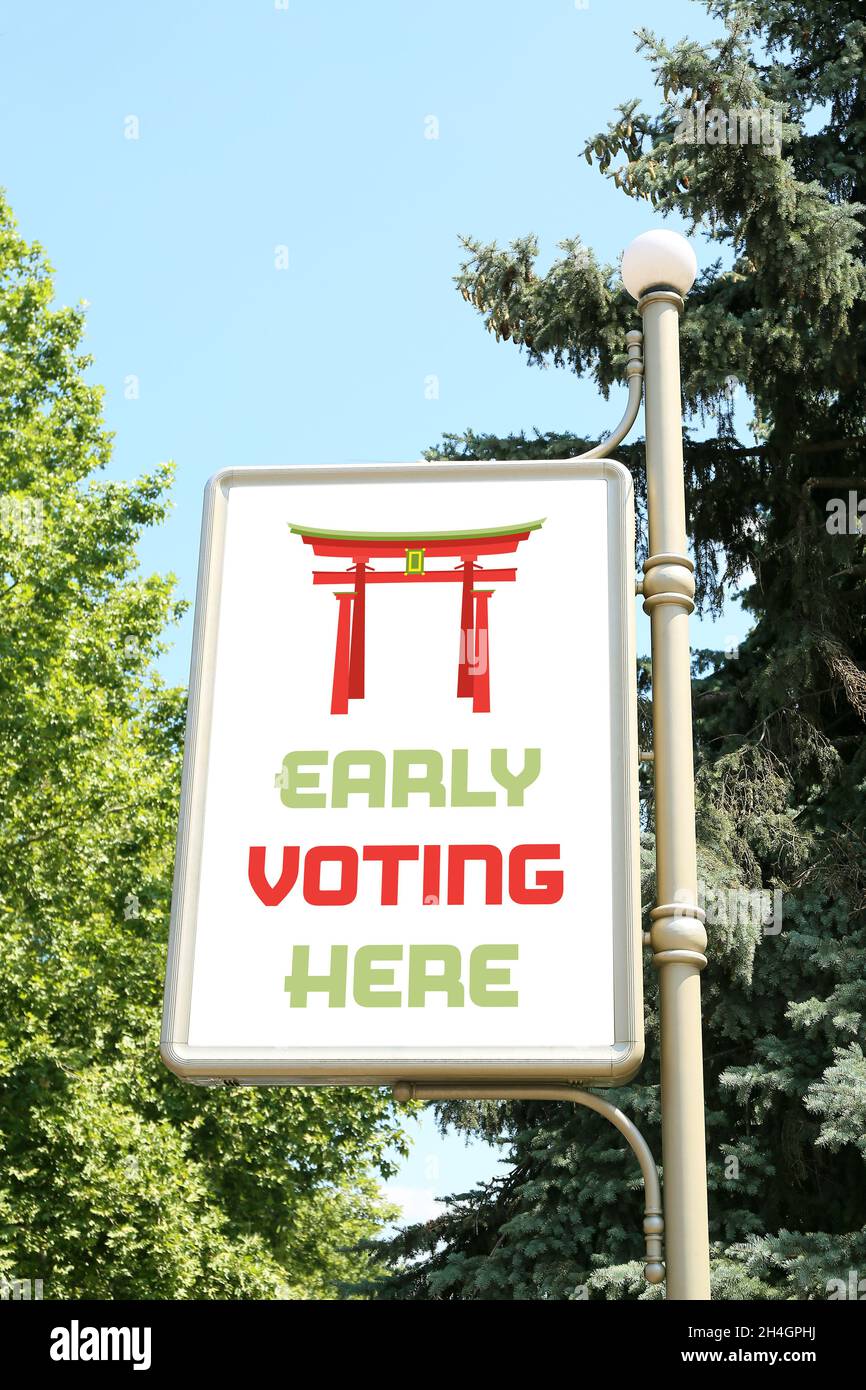 Advertising billboard with text EARLY VOTING HERE outdoors Stock Photo ...