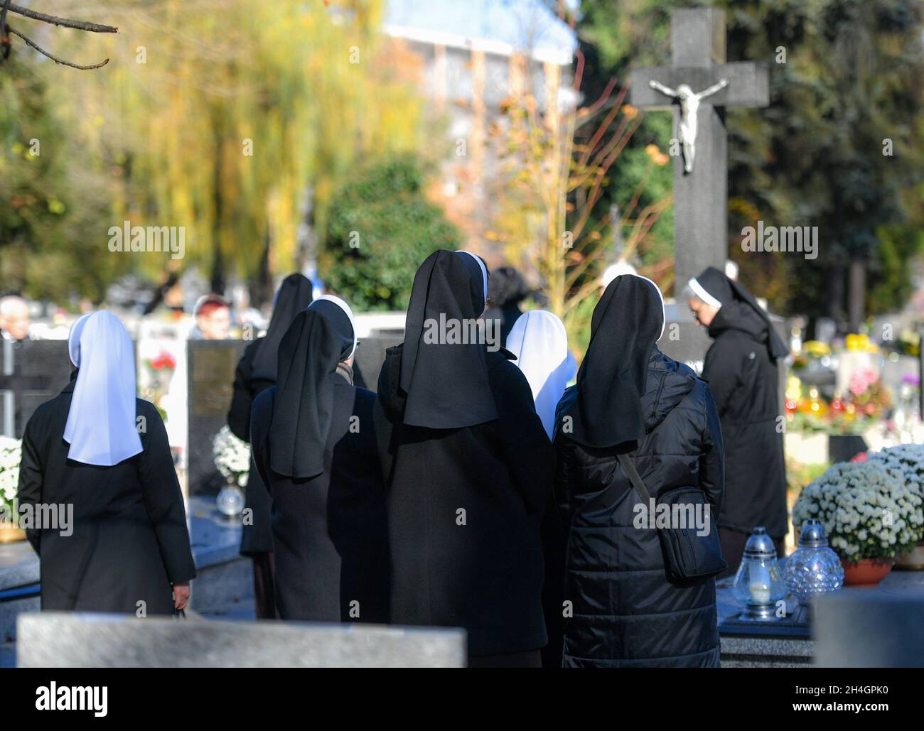 Nuns seen in front of the mass grave of nuns at the Rakowice cemetery ...