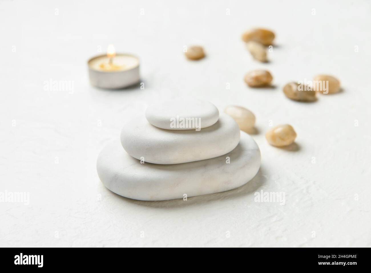 Spa stones on white background Stock Photo - Alamy