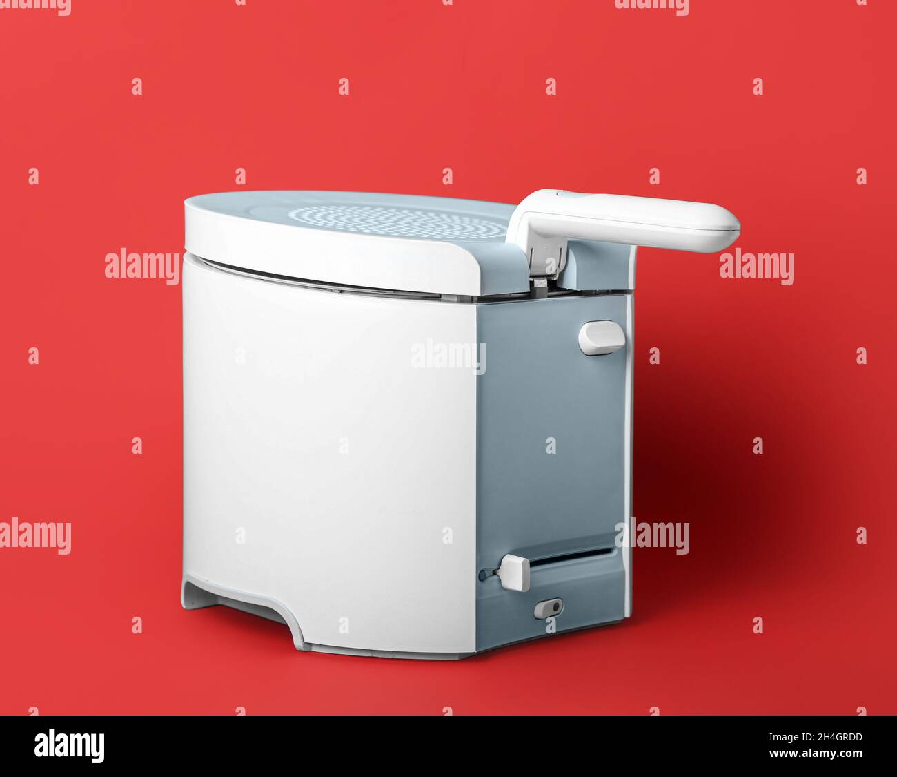 Modern deep fryer on color background Stock Photo - Alamy