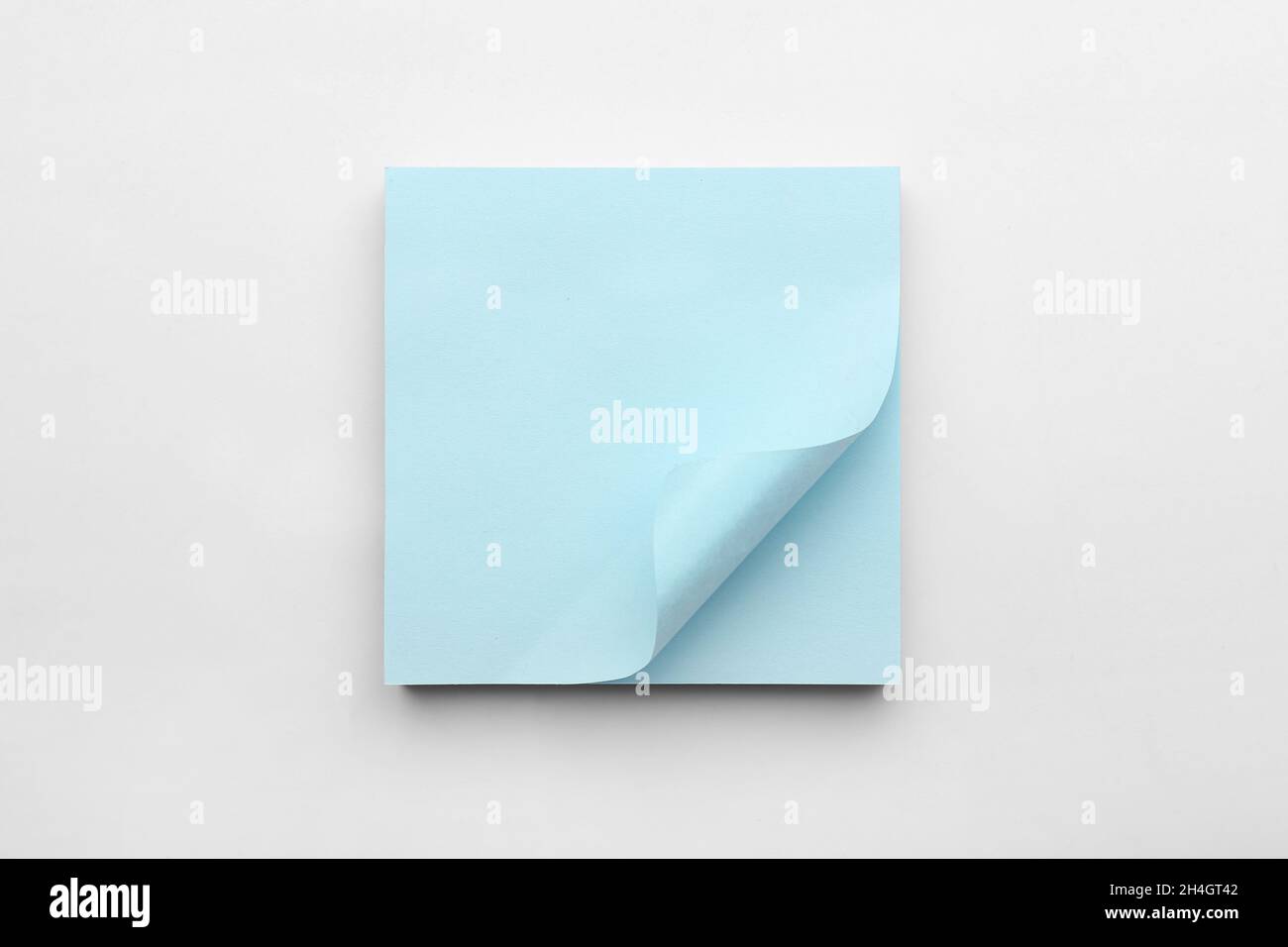 Blue sticky notes on white background Stock Photo - Alamy