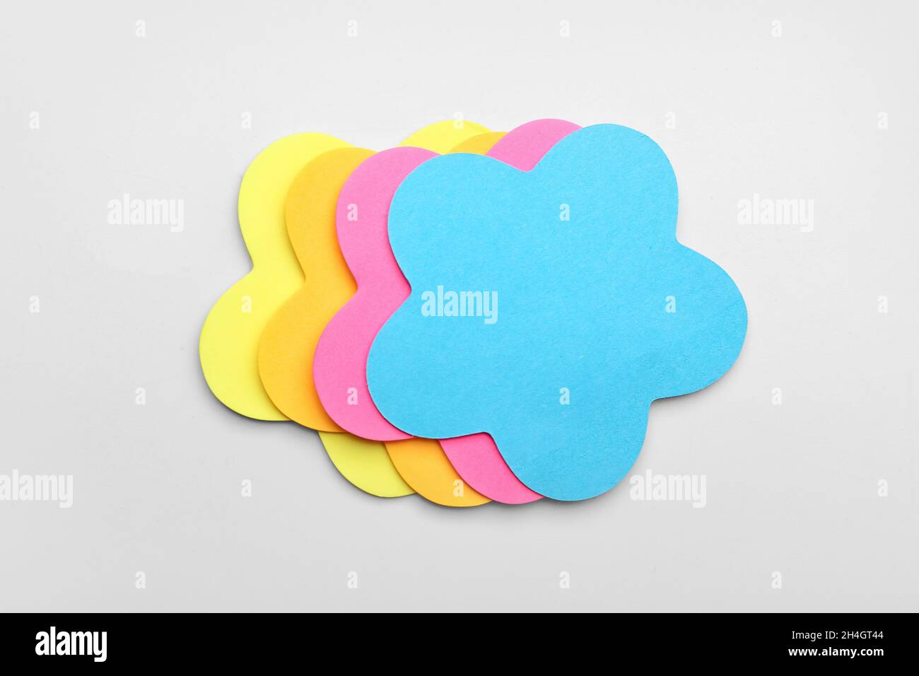 Sticky notes in shape of flowers on white background Stock Photo - Alamy