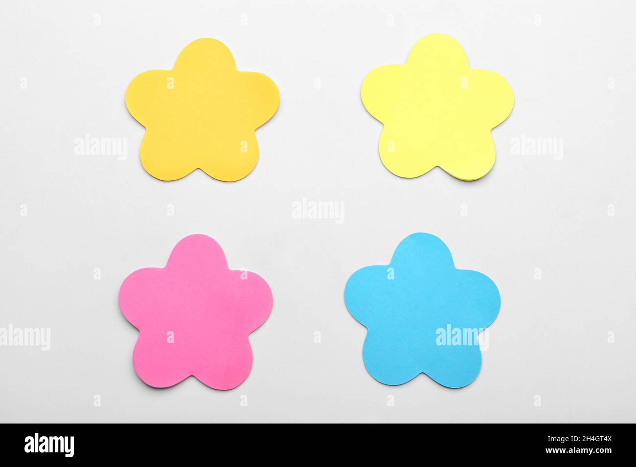Sticky notes in shape of flowers on white background Stock Photo - Alamy