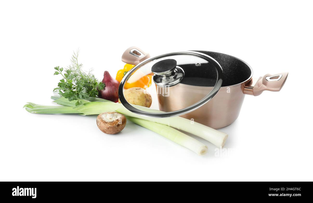 Cooking pot with vegetables on white background Stock Photo - Alamy