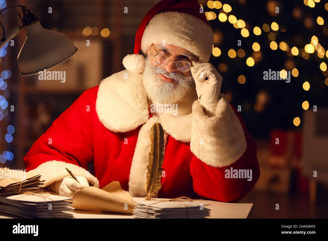 Santa Claus writing letter on Christmas eve Stock Photo - Alamy