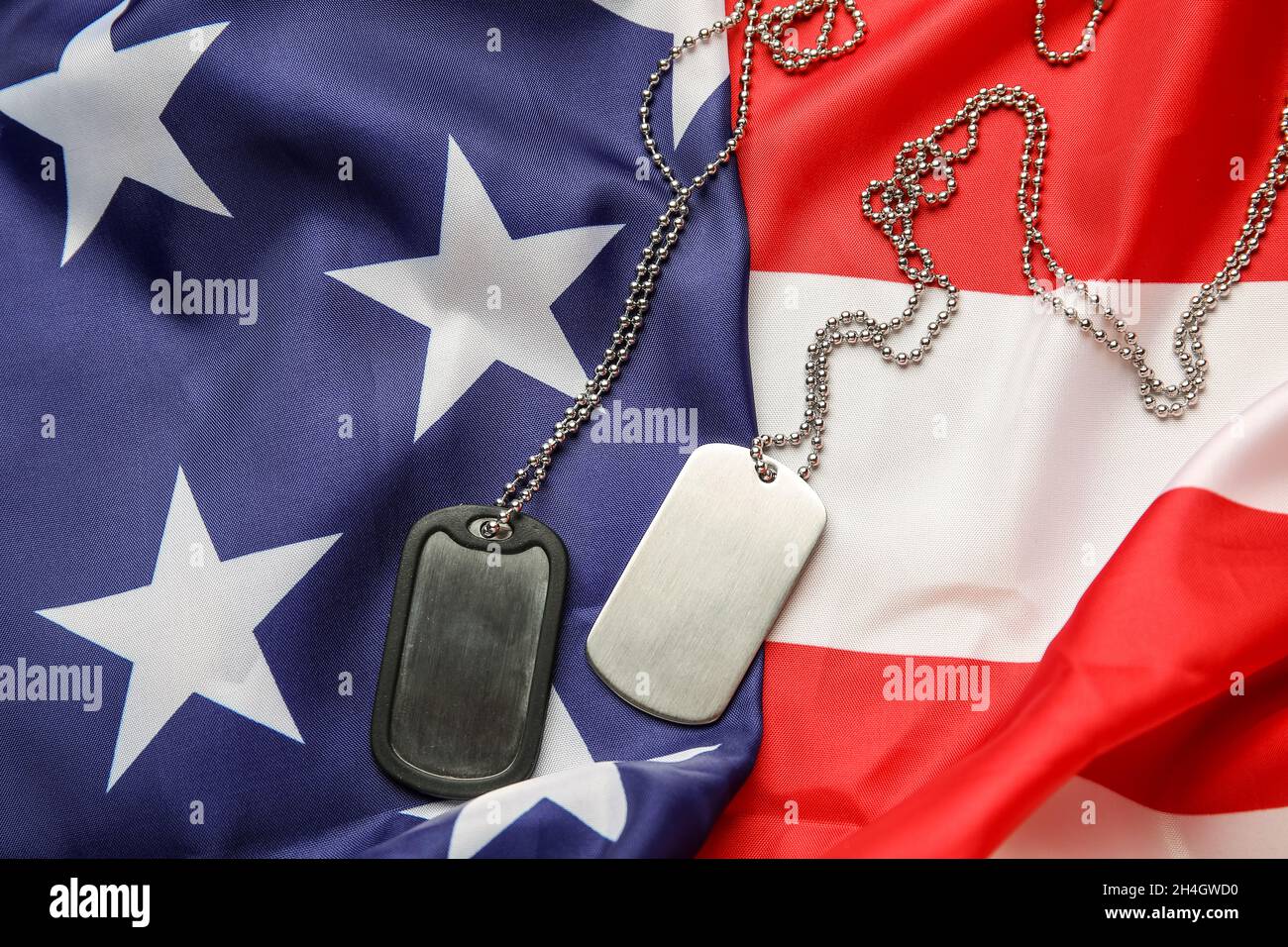 Military tags on flag of USA Stock Photo - Alamy