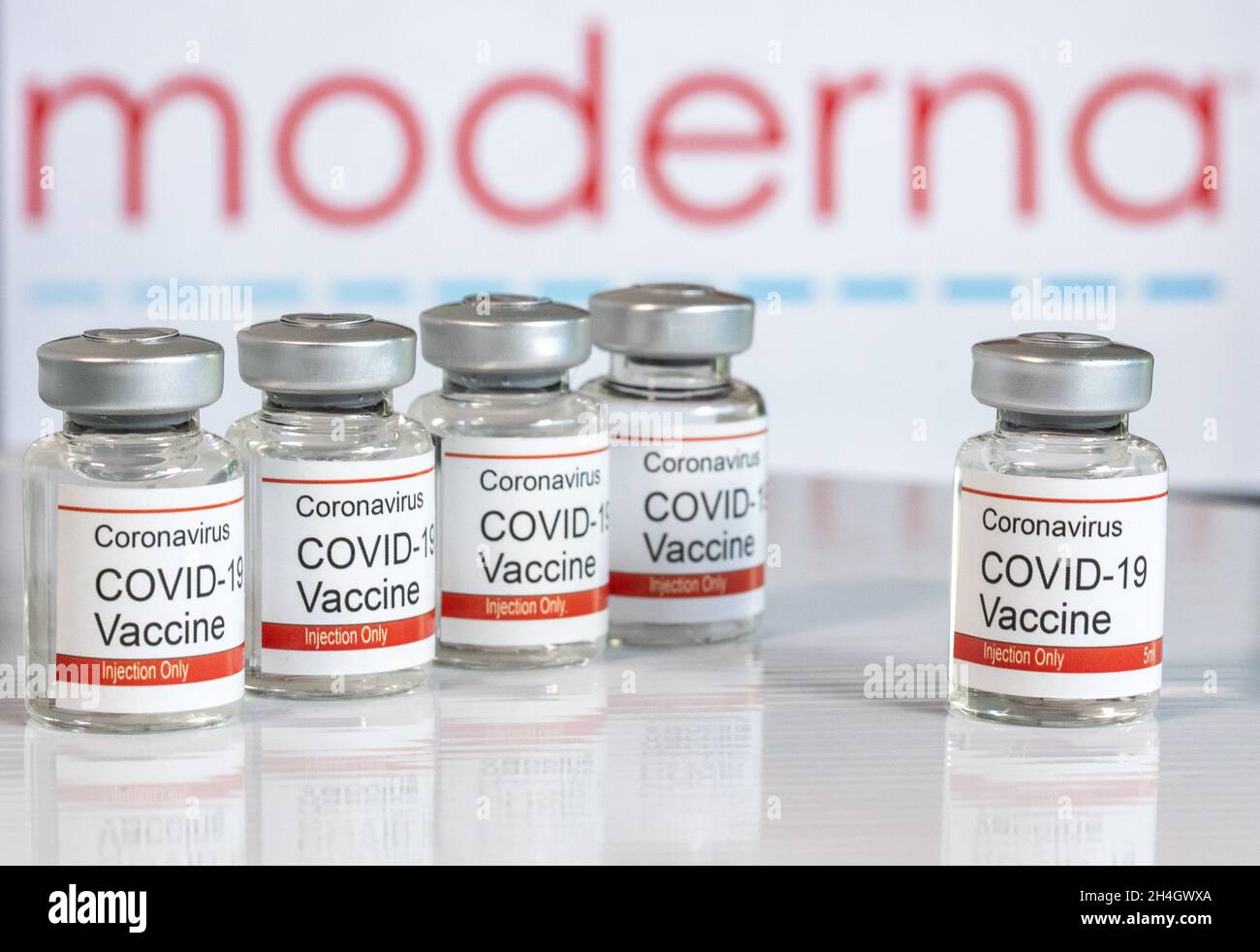 Vials of Coronavirus vaccine with the Moderna logo in the background ...