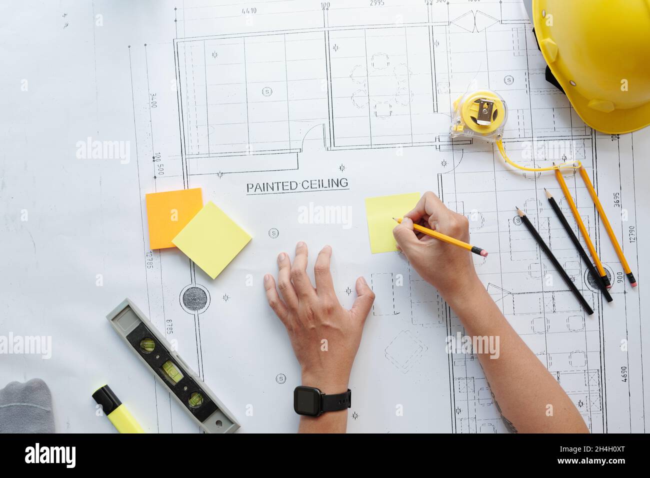 Engineers hands drawing building plan hi-res stock photography and ...