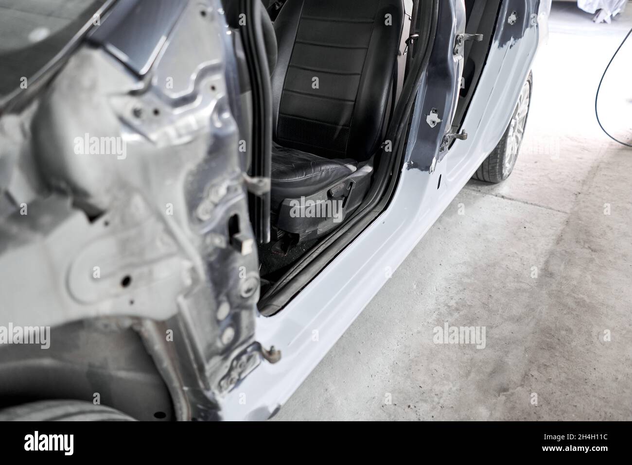 Repairing car body, Application putty close up. The mechanic repair the ...