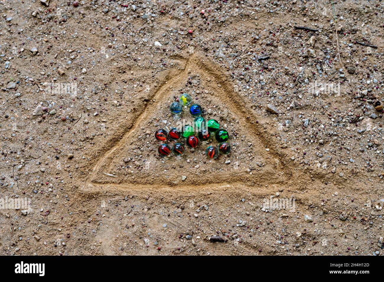 A collection of beads of various colors used in bead play, a ...