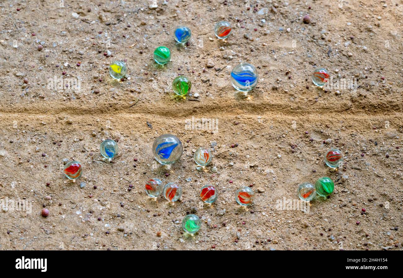 A collection of beads of various colors used in bead play, a ...