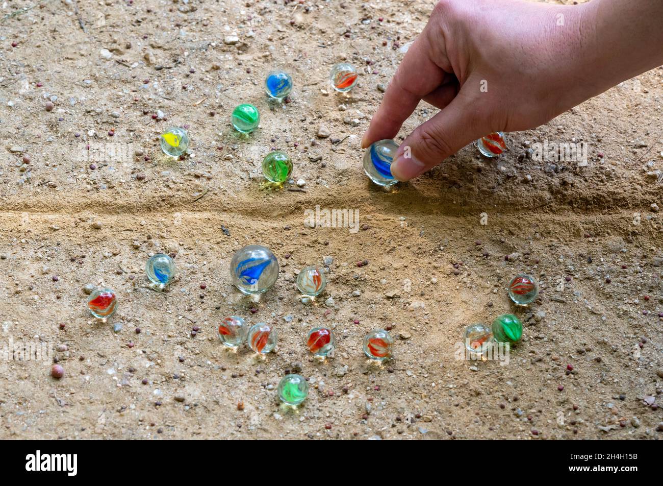 A collection of beads of various colors used in bead play, a ...