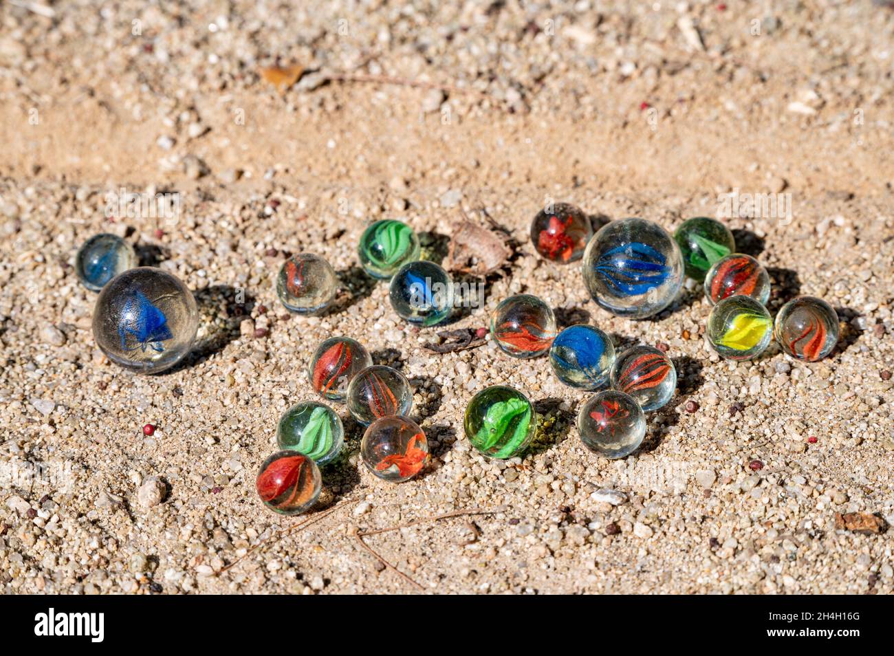 A collection of beads of various colors used in bead play, a ...