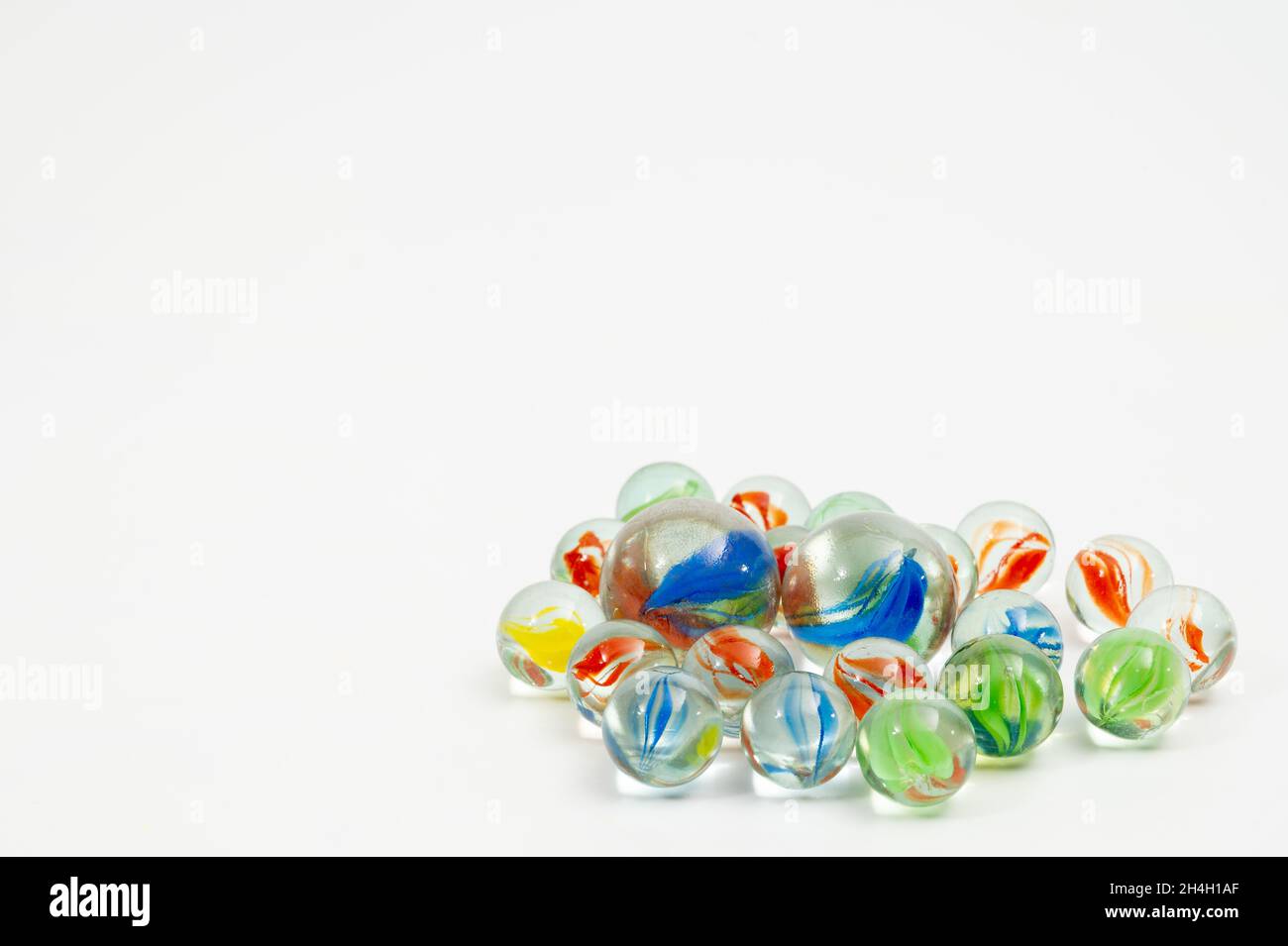 A collection of beads of various colors used in bead play, a ...