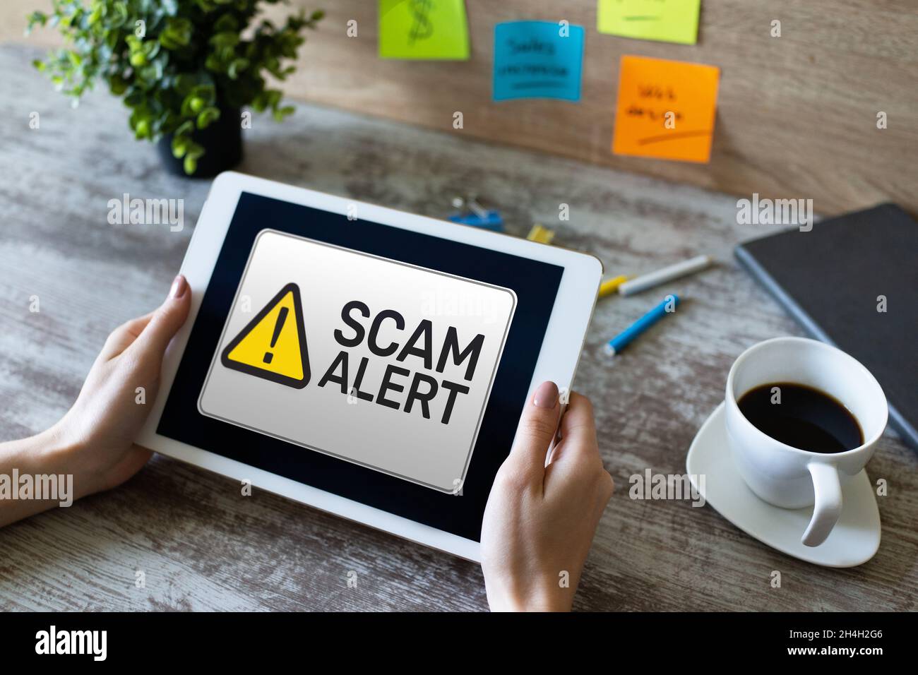 Scam alert detecting warning. Notification on device screen Stock Photo ...