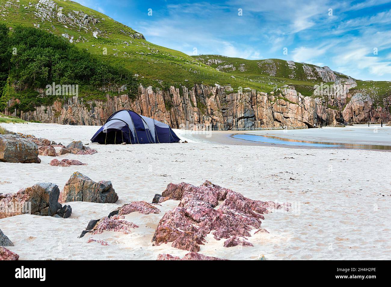 Tent in a bay with rocks and sandy beach, Rispond Bay, Durness ...
