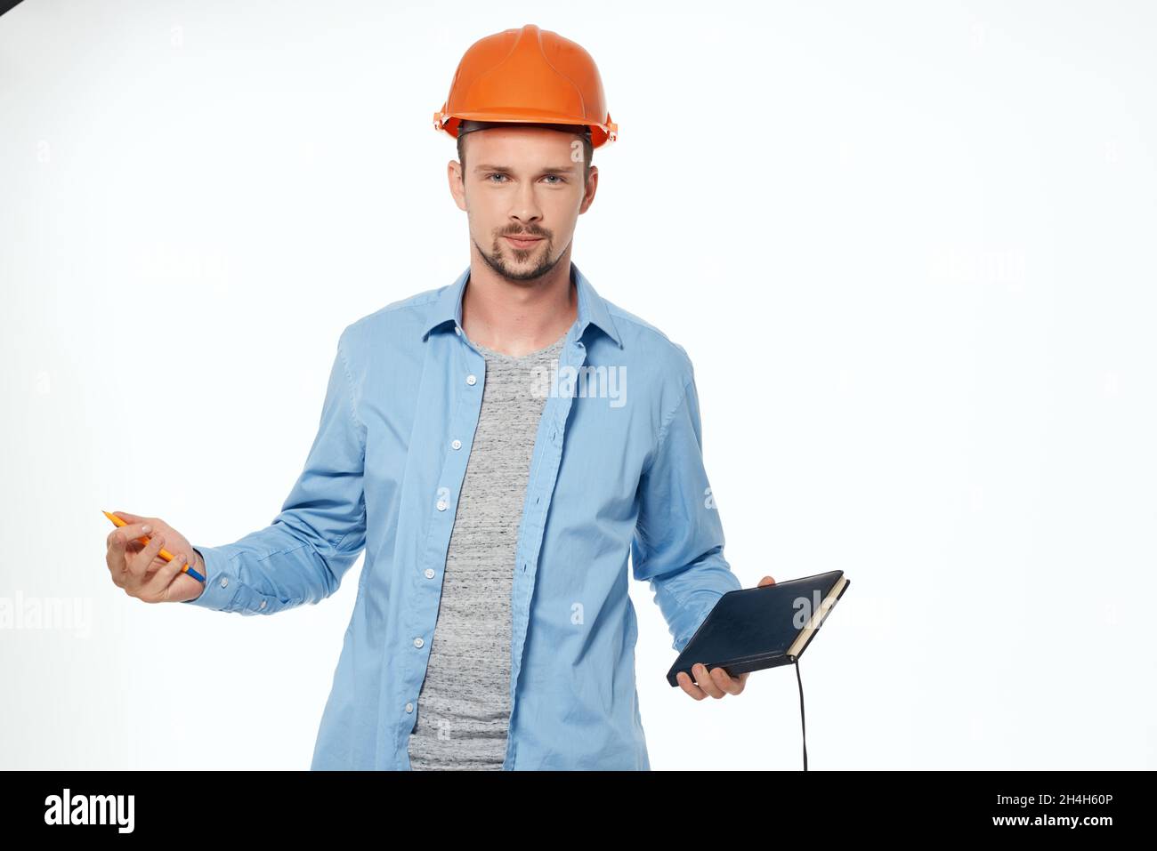 man in construction uniform Professional Job light background Stock ...