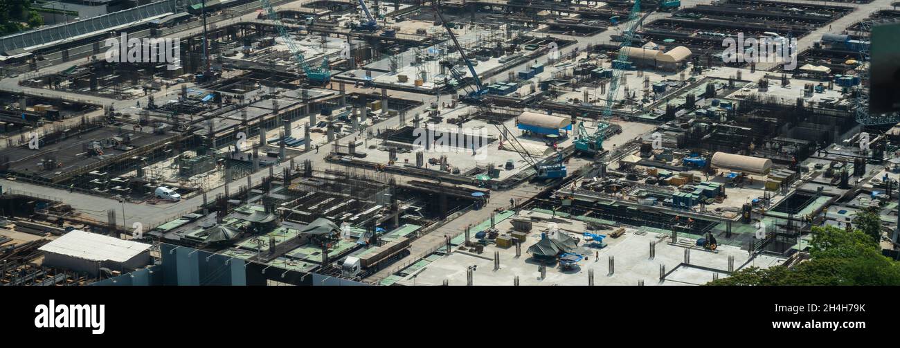 Large construction site with heavy construction machinery in metropolis ...