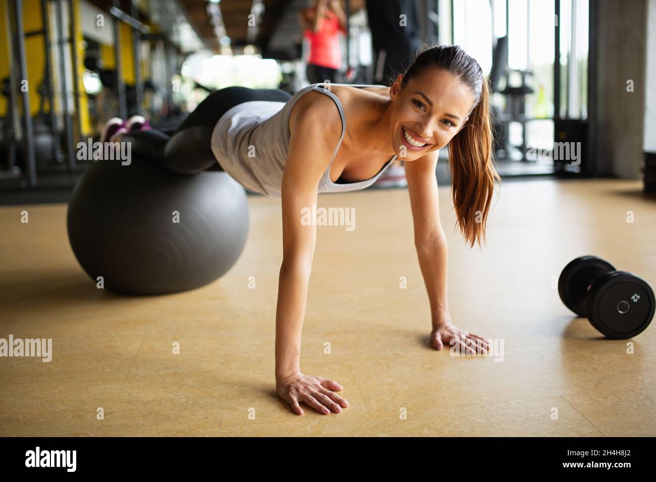 Beautiful fit woman training pilates in gym. Sport people health work ...