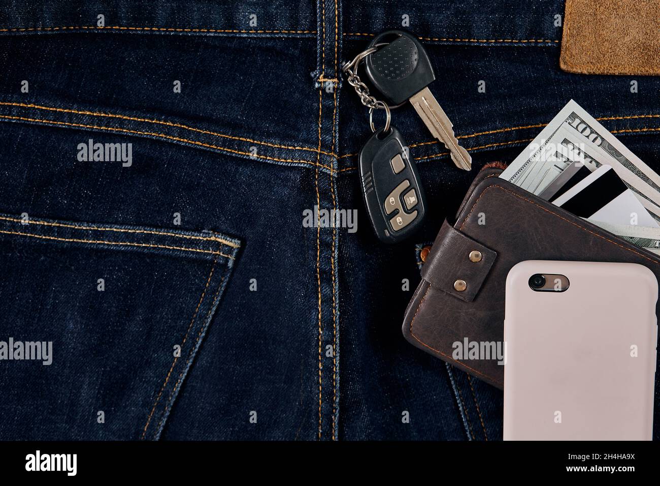 Money, Debit card and Credit card are in pocket of blue jean, Car keys ...