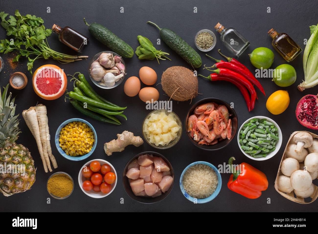 Set of products for the preparation of Thai cooking dishes on a black ...