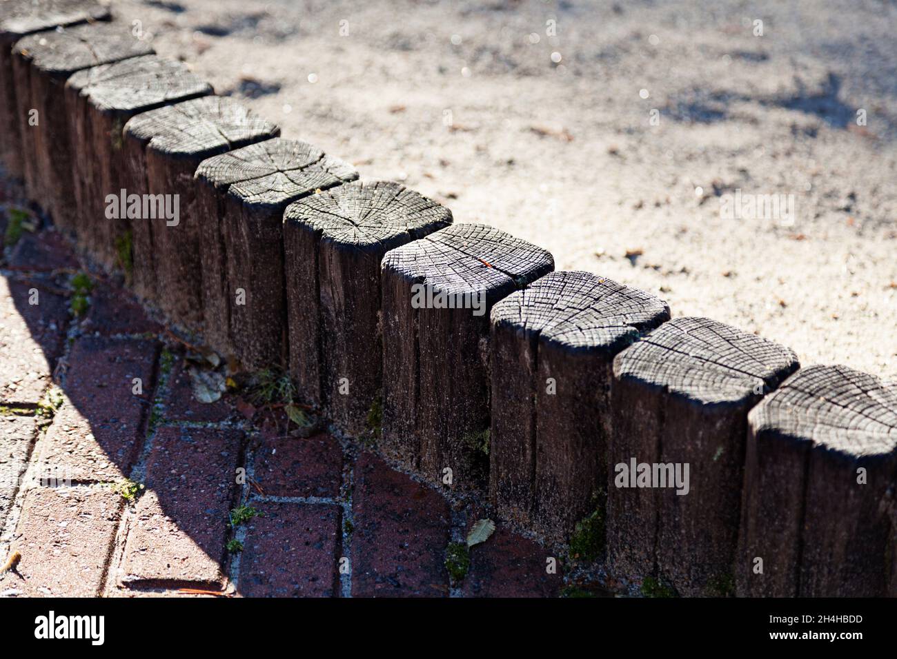 wooden edge to a sandbox outdoors Stock Photo - Alamy