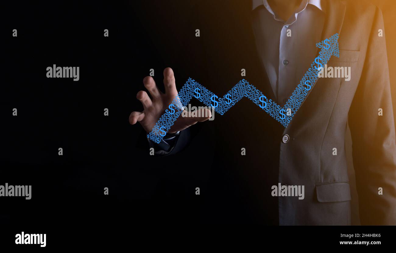 Businessman man holding a graph with positive profits growth. plan ...