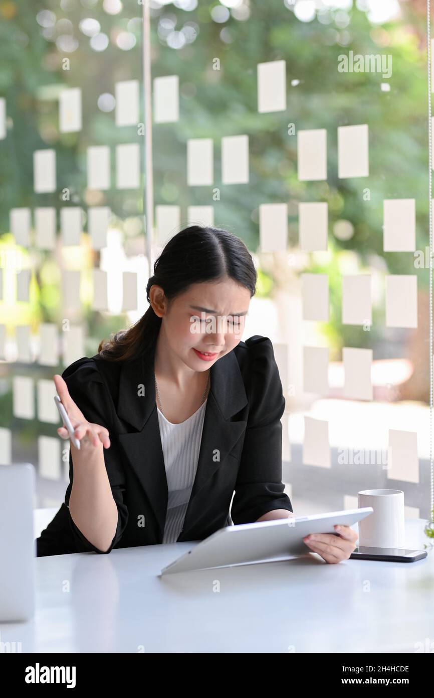 Upset looking tablet screen office hi-res stock photography and images ...