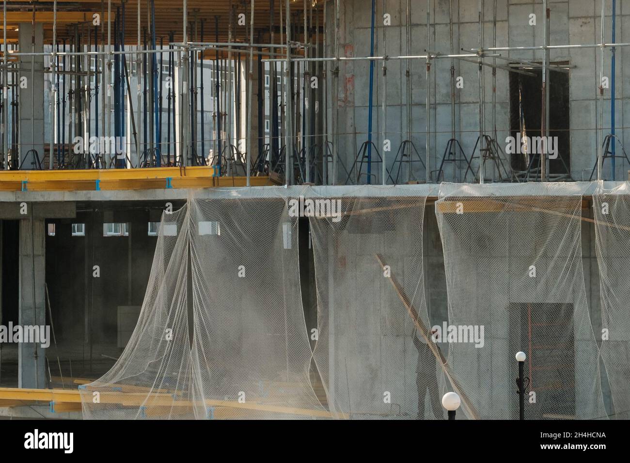 Protective building network used on building. Falsework used on ...