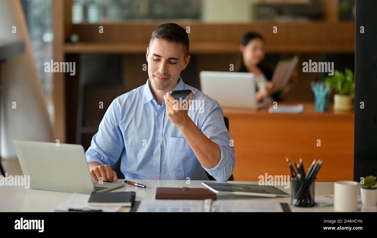 Male employee in marketing company open speaker phone while calling ...