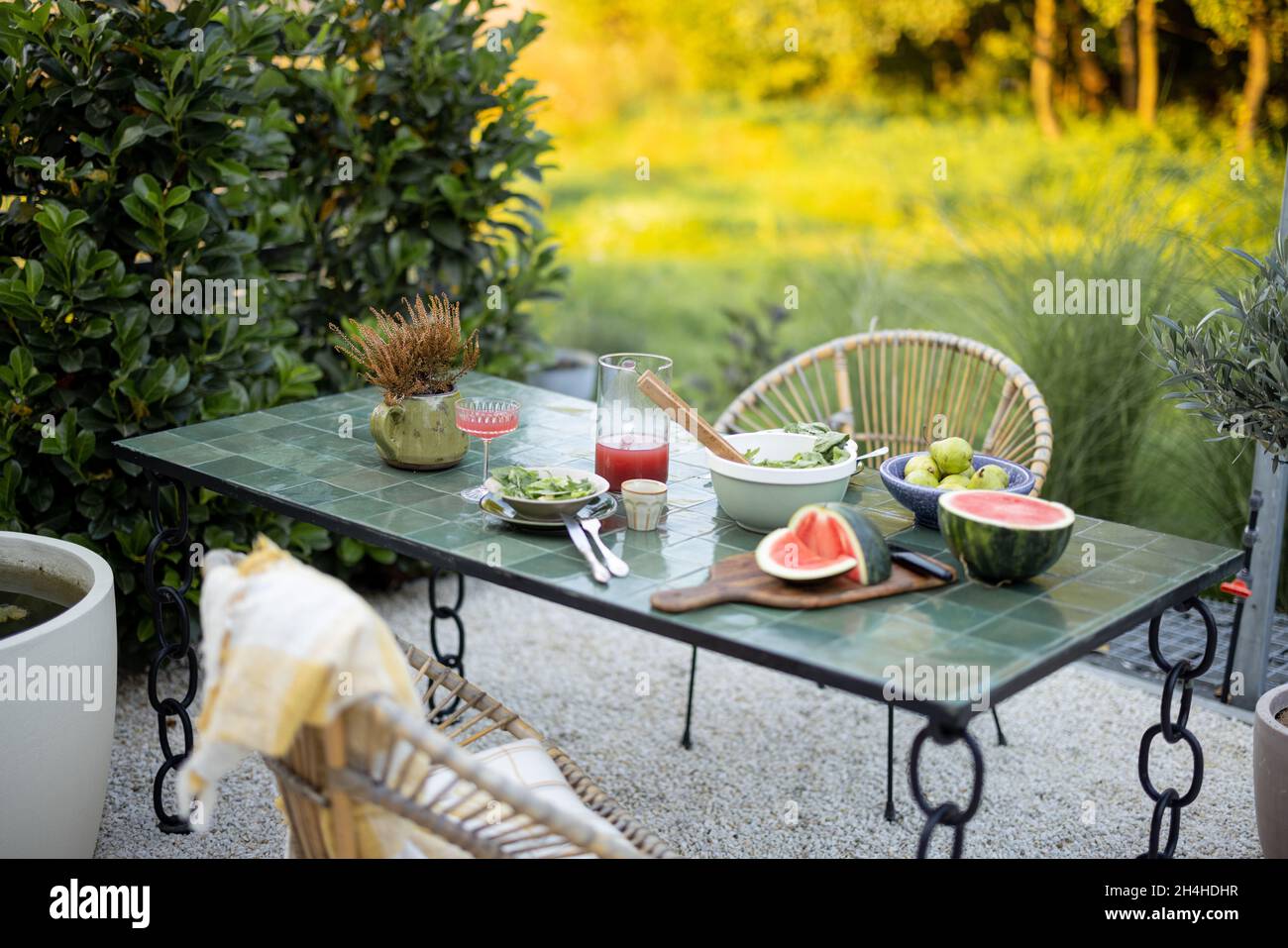 Beautiful lunch set up in garden Stock Photo - Alamy