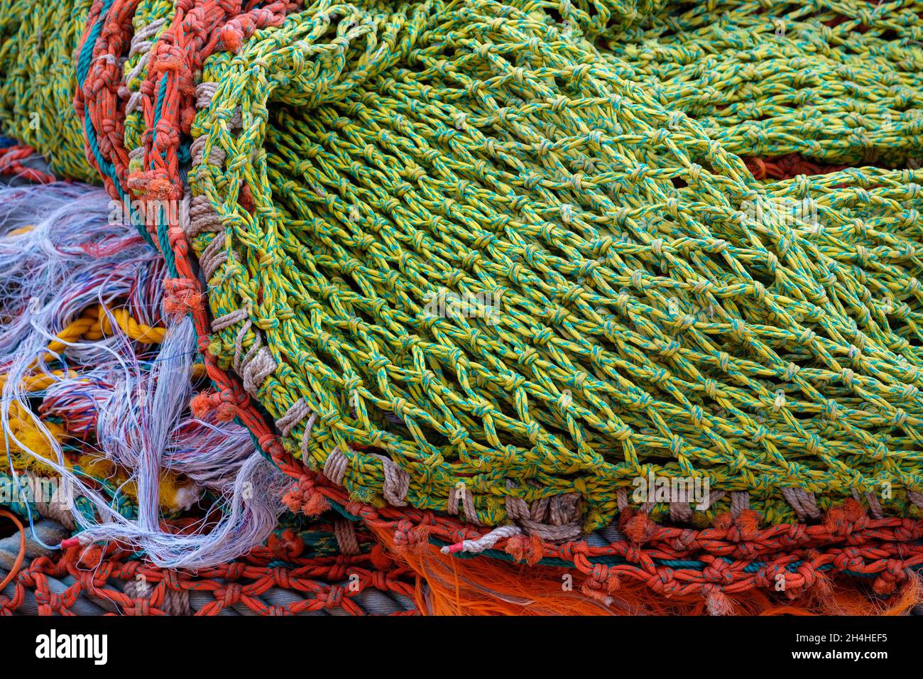 Fishing net on a fishing vessel deck. Close-up shot Stock Photo - Alamy