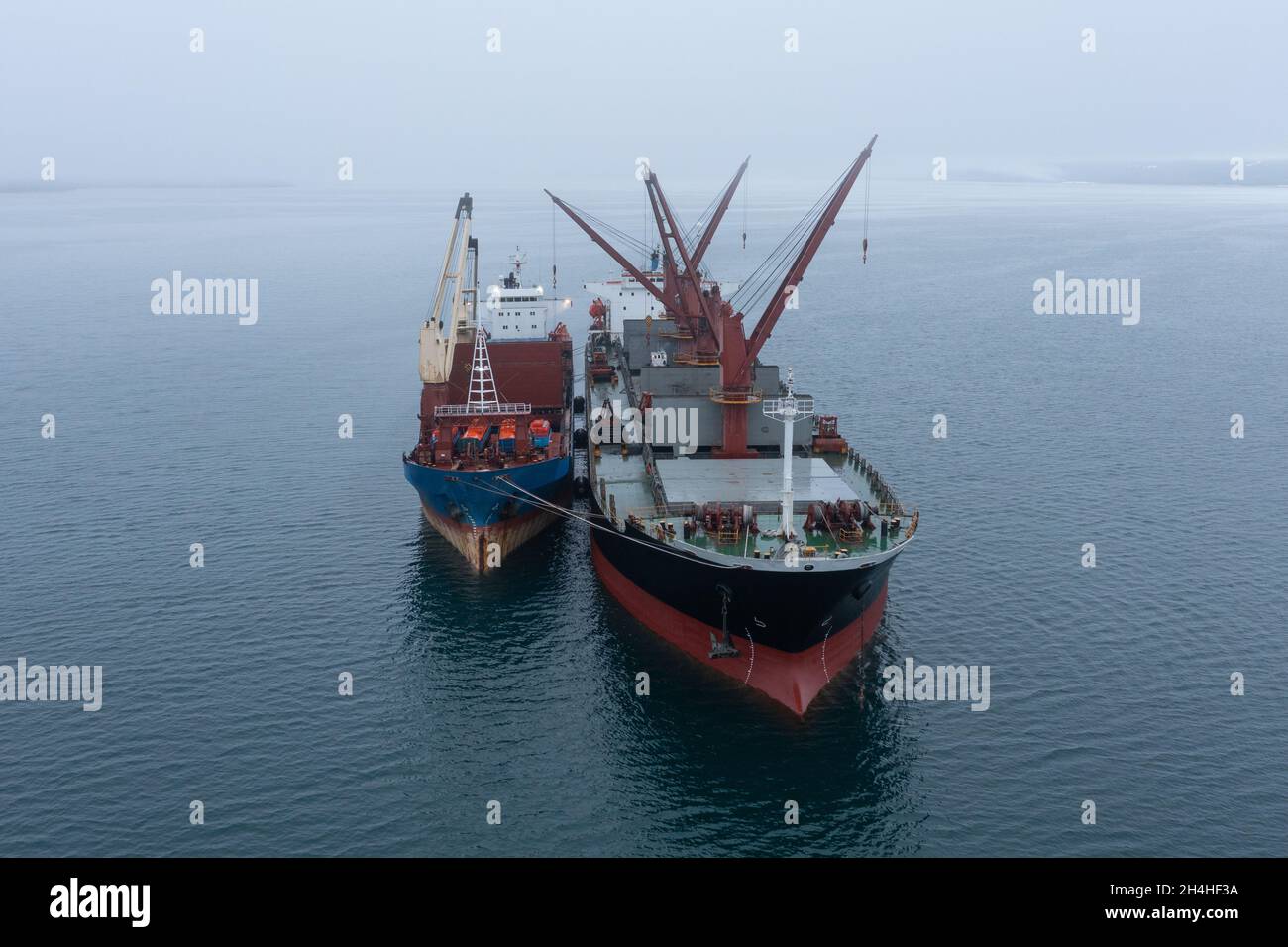 The dry-cargo ships costs in the sea. Vessels overload cargo Stock ...