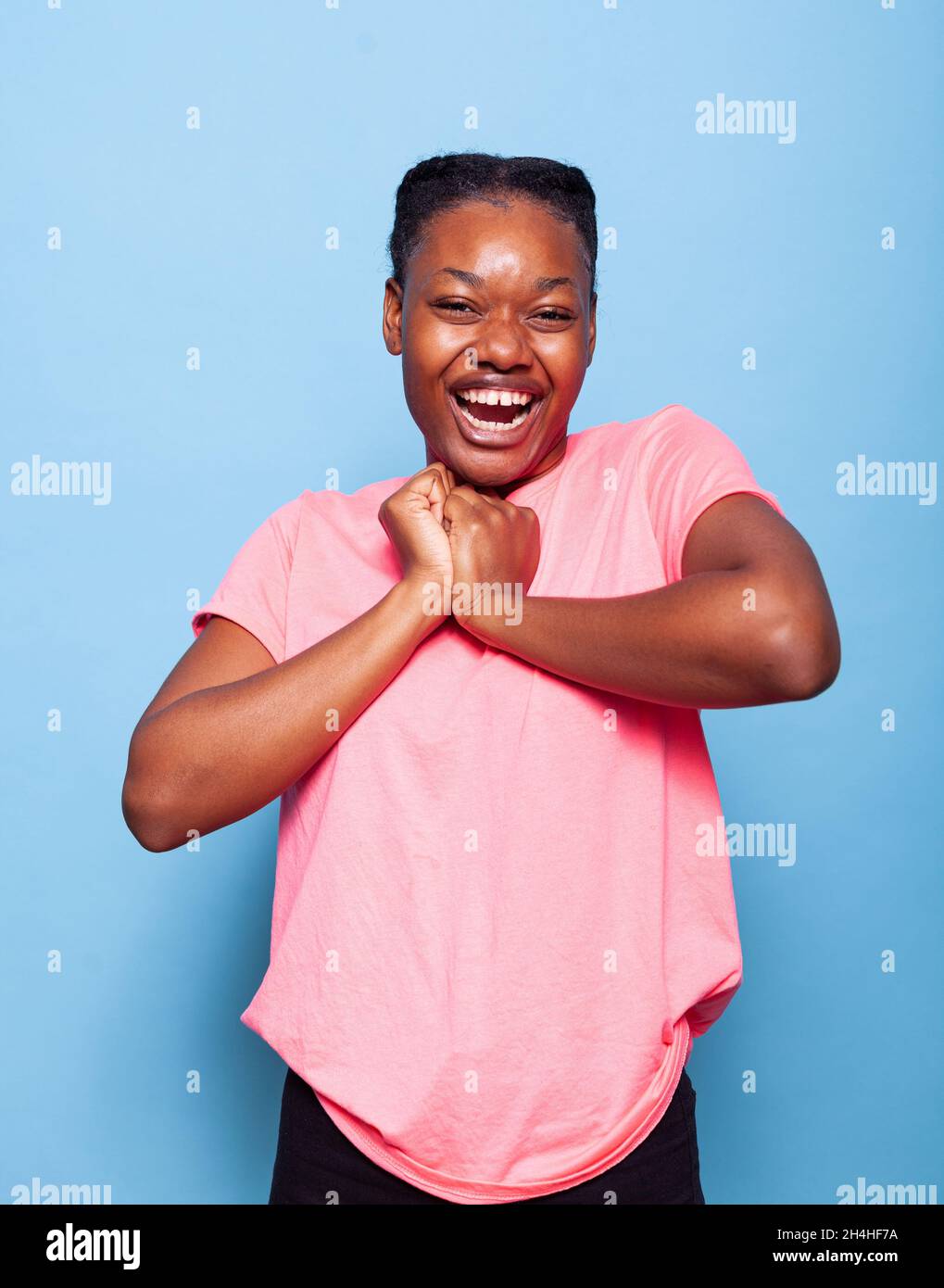 Portrait of excited happy model african american young woman laughing ...